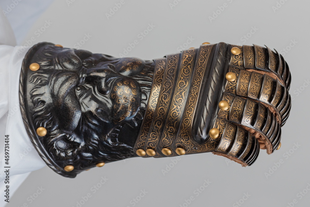 Medieval knightly brown plate gauntlet from Italian armor, in the form ...