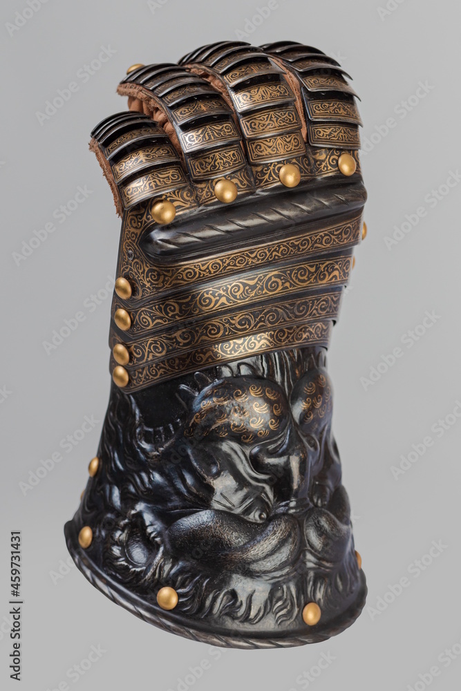 Medieval knightly brown plate gauntlet from Italian armor, in the form ...