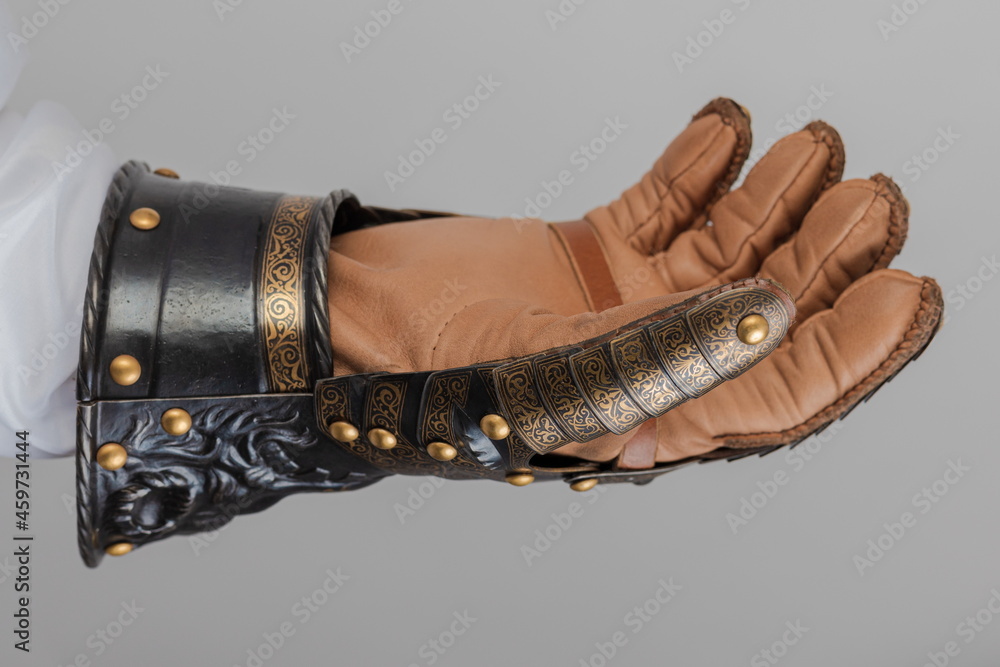 Medieval knightly brown plate gauntlet from Italian armor, in the form ...