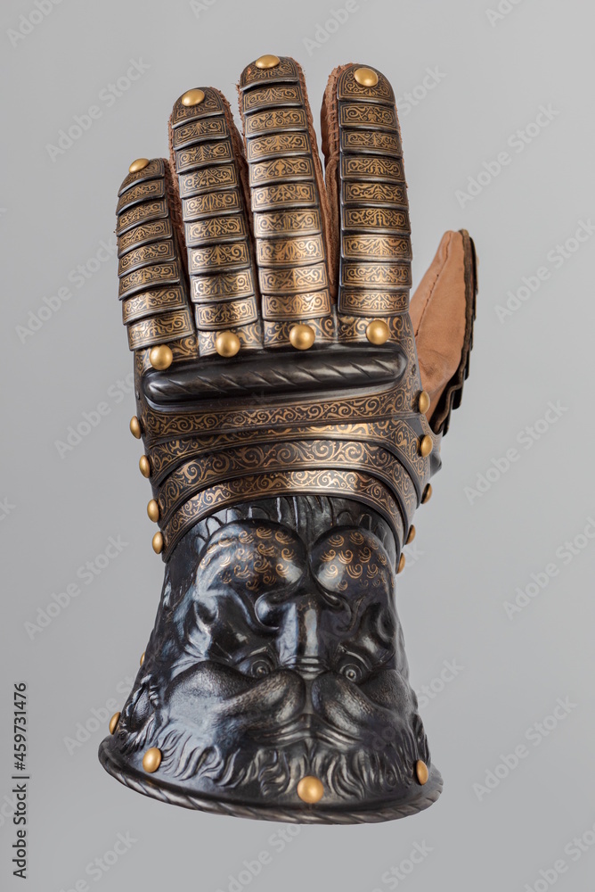 Medieval knightly brown plate gauntlet from Italian armor, in the form ...