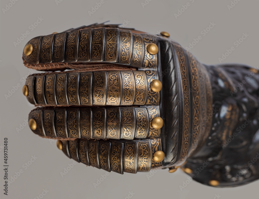 Medieval knightly brown plate gauntlet from Italian armor, in the form ...