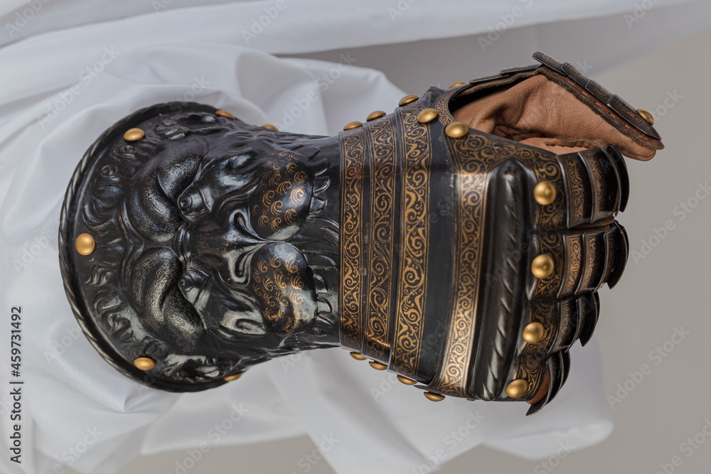 Medieval knightly brown plate gauntlet from Italian armor, in the form ...