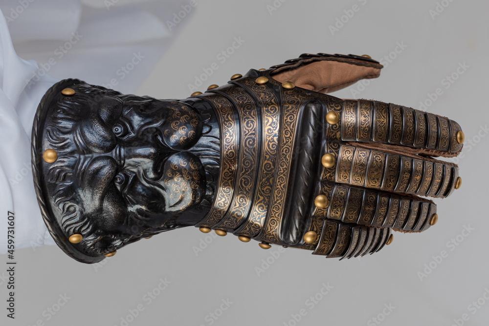 Medieval knightly brown plate gauntlet from Italian armor, in the form ...