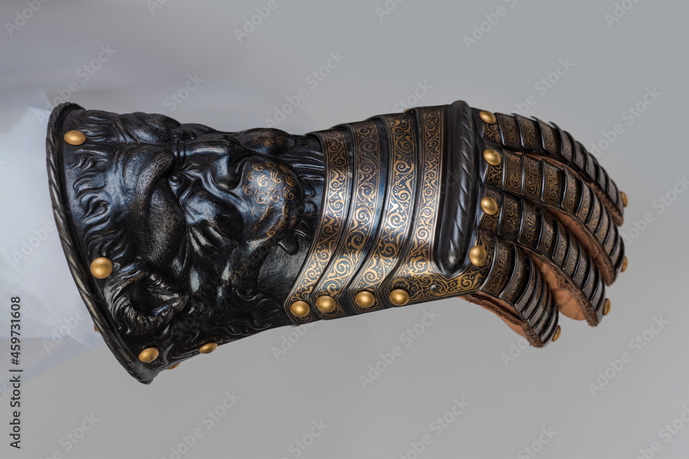 Medieval knightly brown plate gauntlet from Italian armor, in the form ...