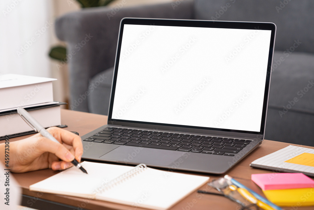 Woman studying e-learning on Laptop with a mockup white screen on ...