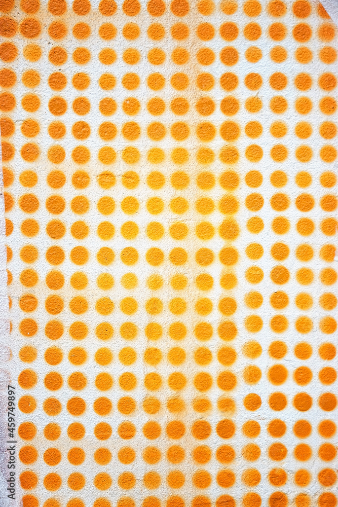 painted yellow dots pattern on stone wall Texture. element of street ...