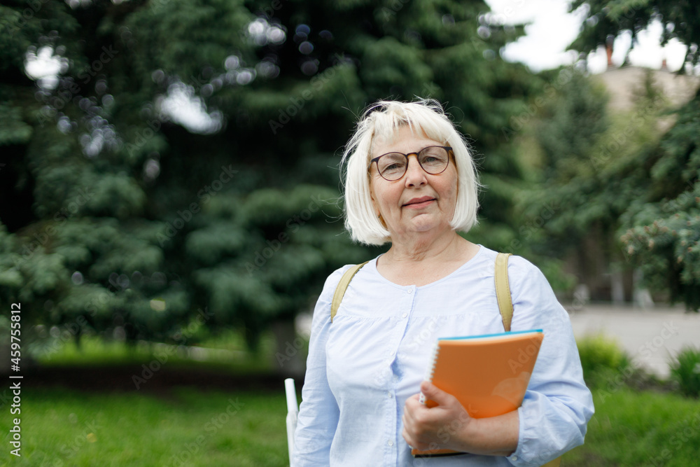 Blonde teacher woman lady 40s 50s years old wearing eyeglasses standing ...