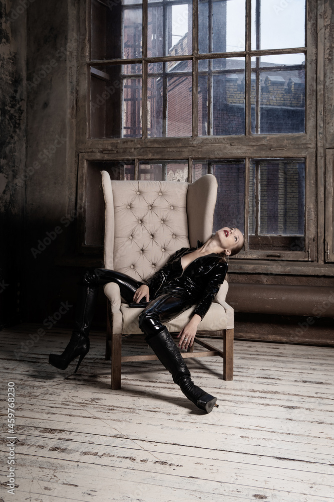 Hit woman. Woman in a latex suit killed in gunfire shot in the head ...