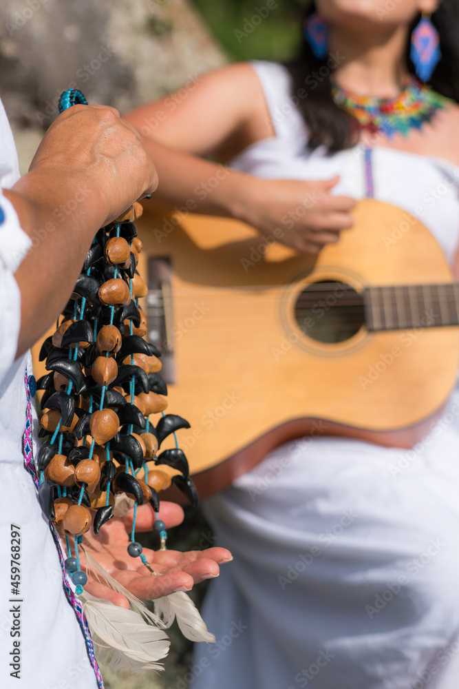 Women playing instruments outdoors. music in nature, indigenous ...