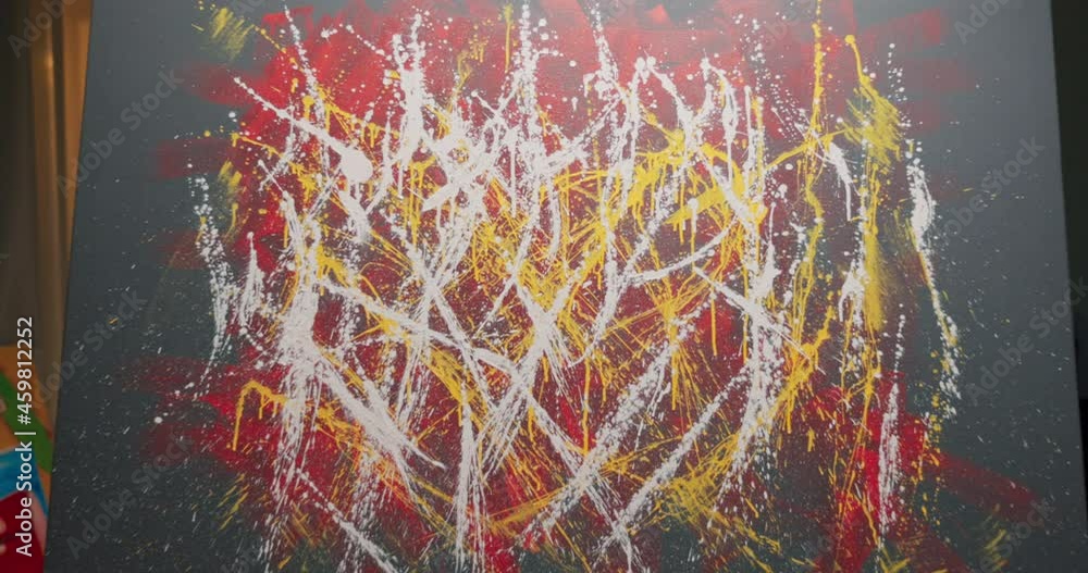 Abstract modern crazy painting in yellow red white colors standing on ...