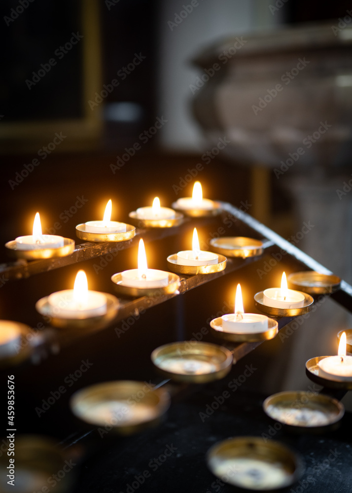 Candle of remembrance burning light and bright in church. Flame and ...