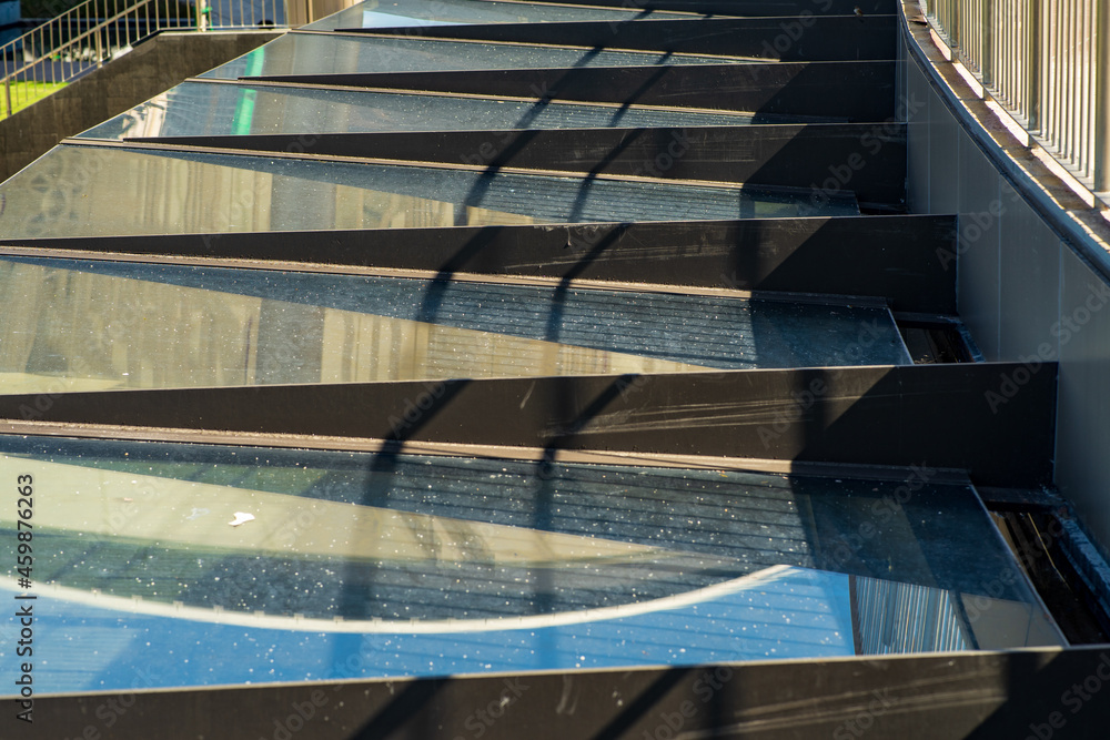 High-tech architecture glass roof. External structure of glass roof in ...