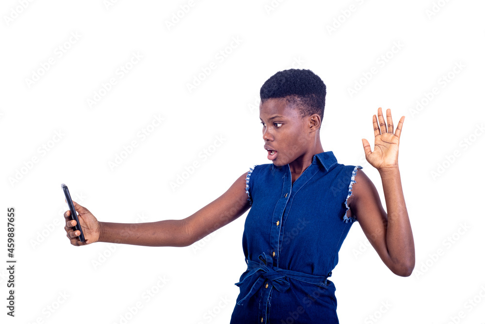 beautiful surprised young woman raising her hand during a video call on ...