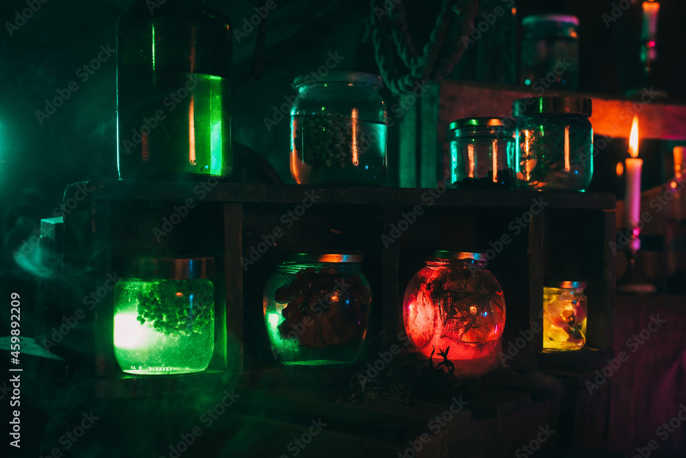flasks of magic potions with poison in the workshop of an alchemist ...