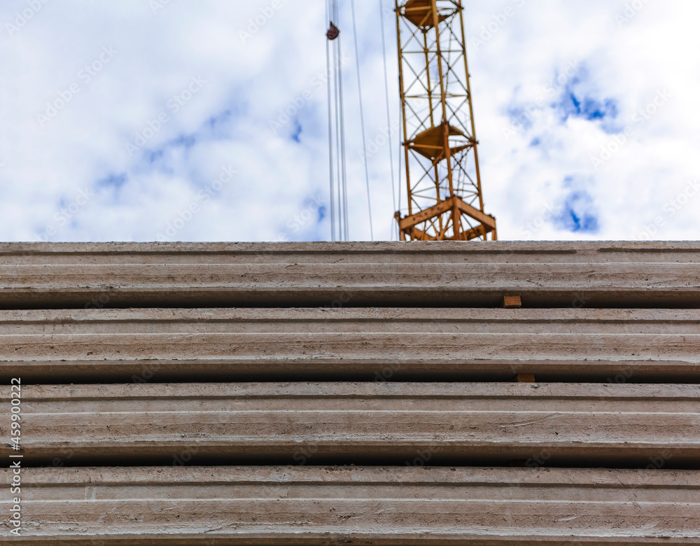 Concrete floor slabs on a background of sky and tower crane Stock Photo ...