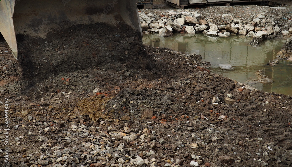 excavator, construction car manita with a bucket at work, green color ...