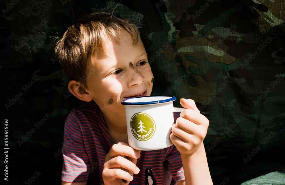 boy building an outdoor play house in the forest on an adventure Stock ...