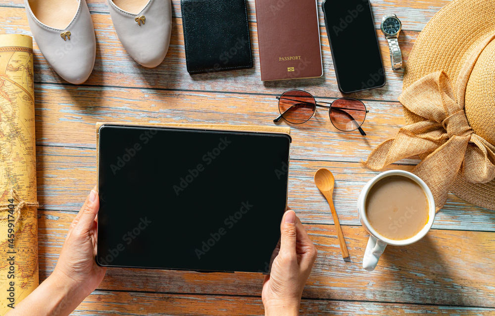 Plan a trip with a tablet,Plan a trip with a tablet,Packed suitcase of ...