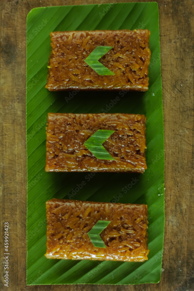Wajik on wood background. Wajik is traditional snack made with steamed ...