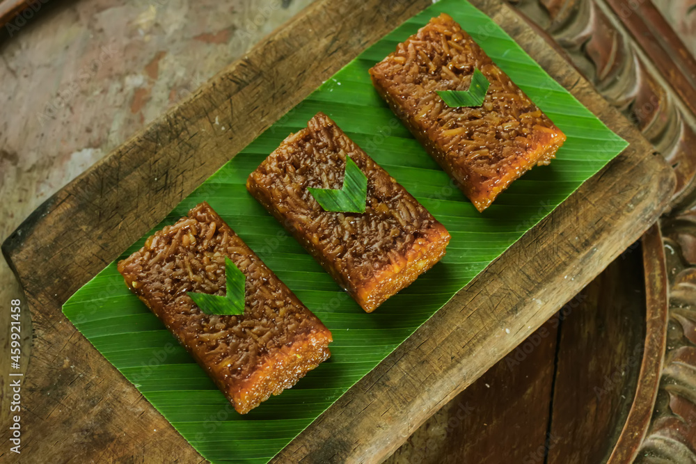 Wajik on wood background. Wajik is traditional snack made with steamed ...