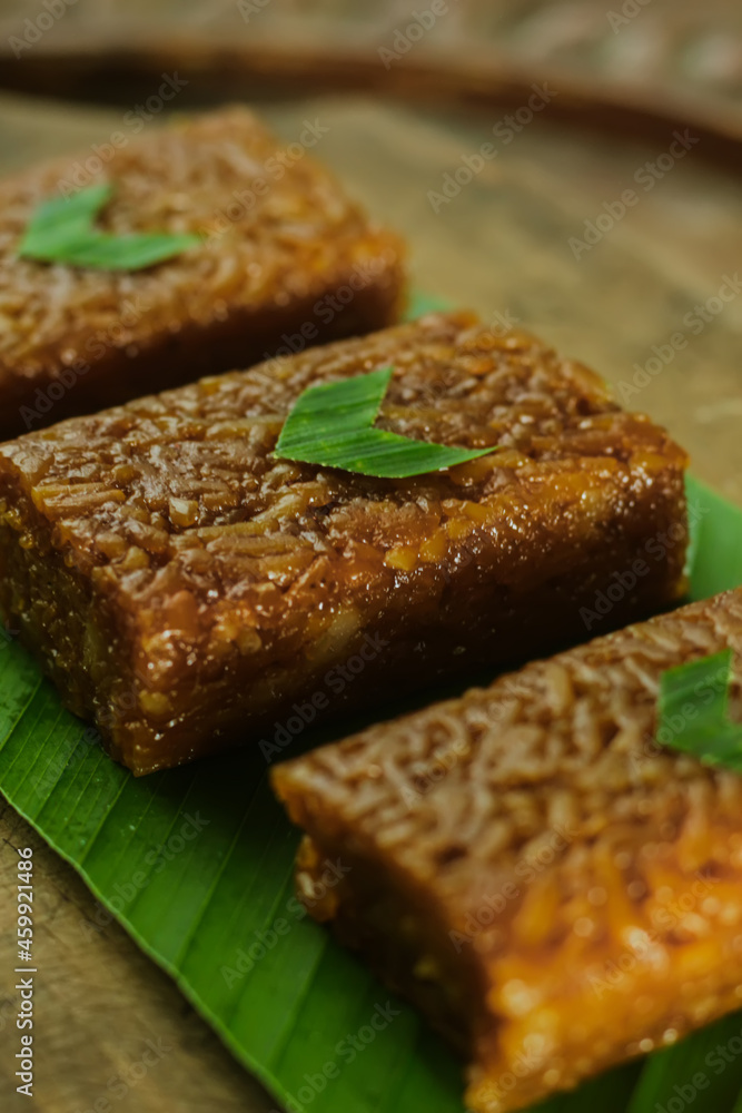 Wajik on wood background. Wajik is traditional snack made with steamed ...