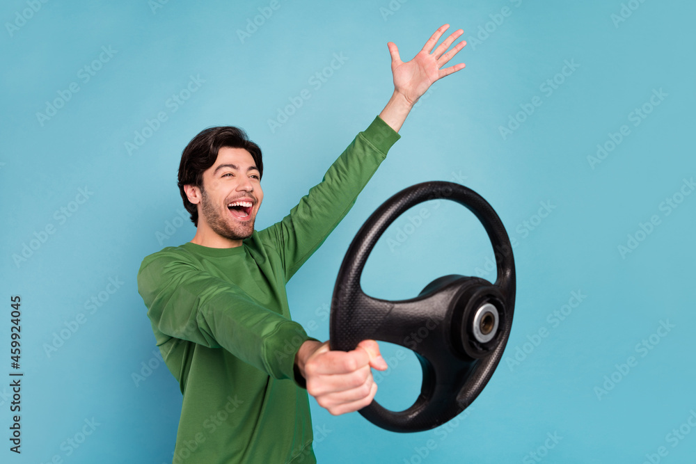 Profile side photo of young amazed crazy guy riding car fast speed ...