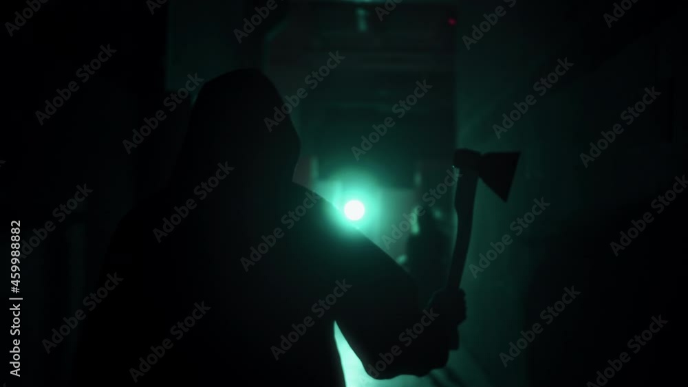Maniac running for woman with axe in dark corridor. Mystical scary ...