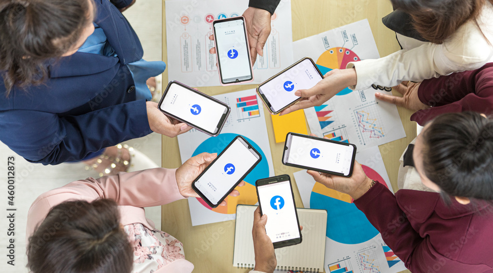 Bangkok/Thailand - August 06, 2021: People hold smartphones in ...