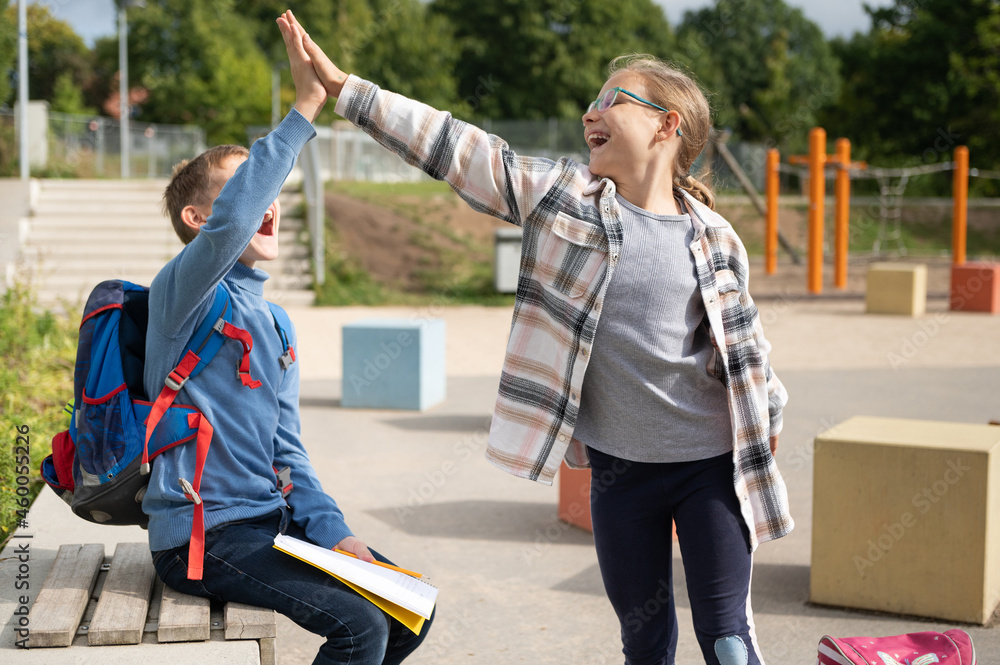 Two happy children celebrate their team success after lessons Stock ...