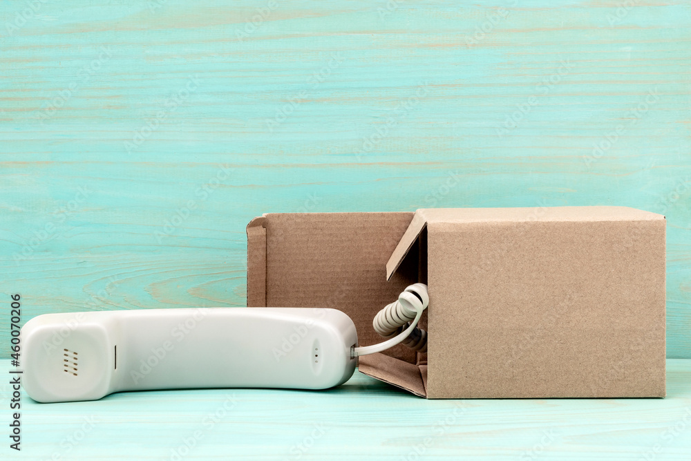 Old telephone receiver in cardboard box with open lid Stock Photo ...