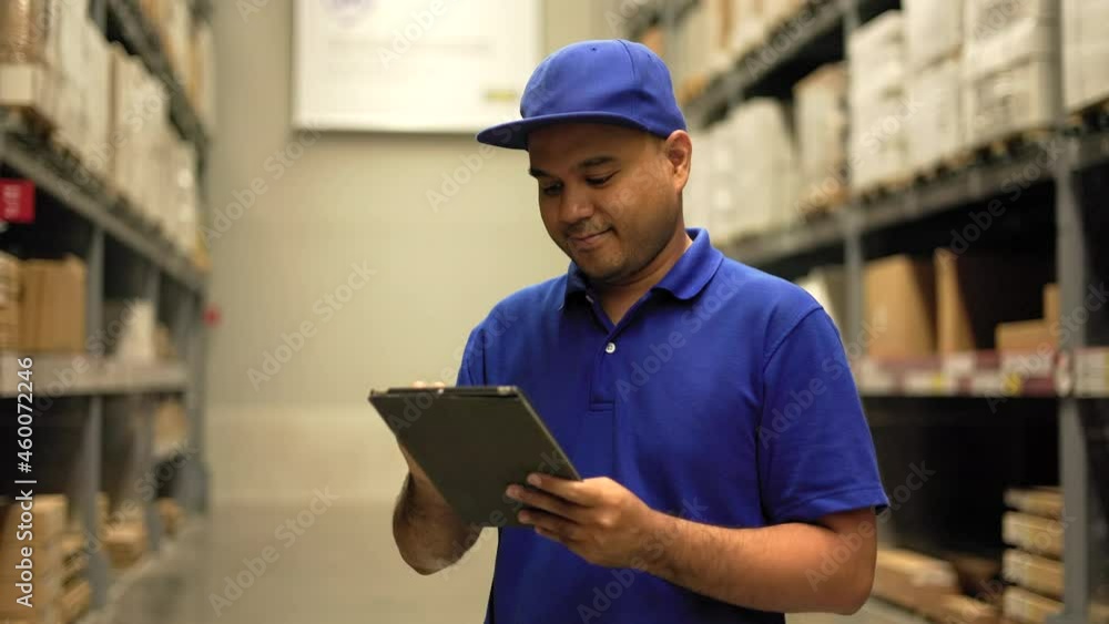 Supply chain. Young worker in blue uniform checklist manage parcel box ...