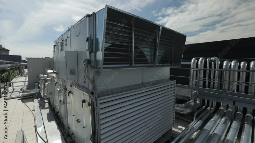 Ari conditioning tubes and pipes on a roof of a shopping center in Rome ...