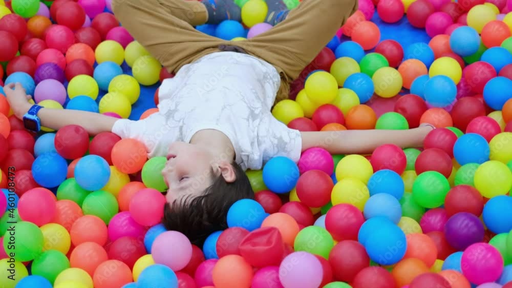 Autistic child in the pool with colored balls. Autism Spectrum Disorder ...