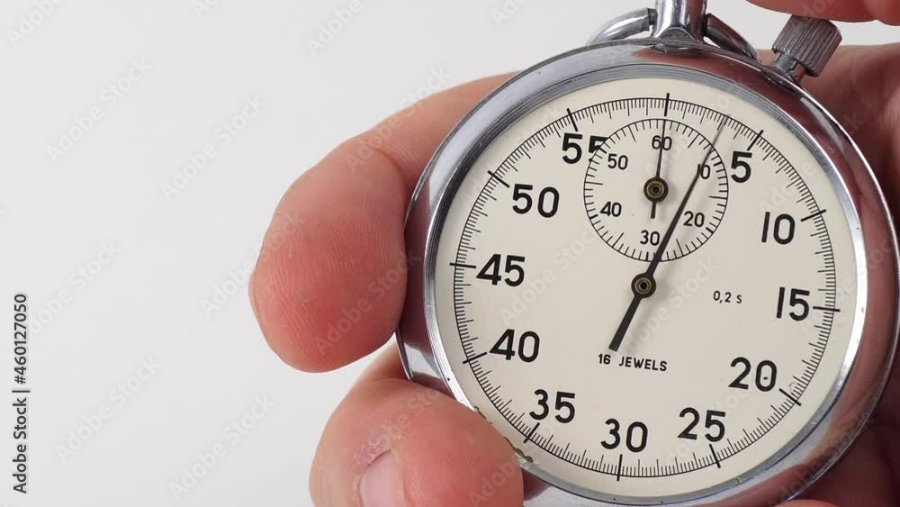 Human Hand hold classic steel mechanical analog stopwatch on white ...