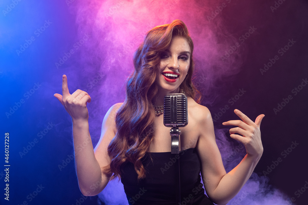 Cropped portrait of beautiful expressive female singer in motion ...