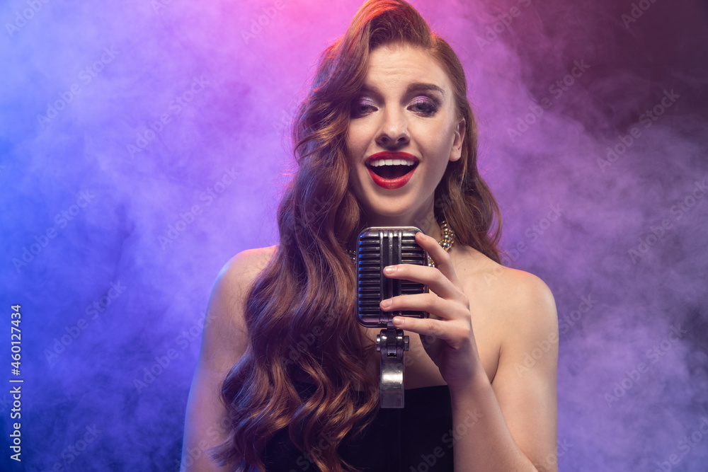 Cropped portrait of beautiful female jazz singer isolated over gradient ...