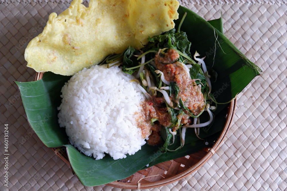 Nasi Pecel. Traditional Javanese rice dish of steamed rice with ...