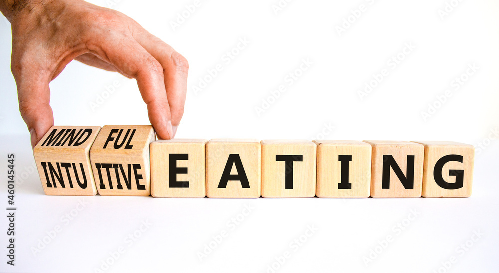 Mindful or intuitive eating symbol. Doctor turns cubes and changes ...