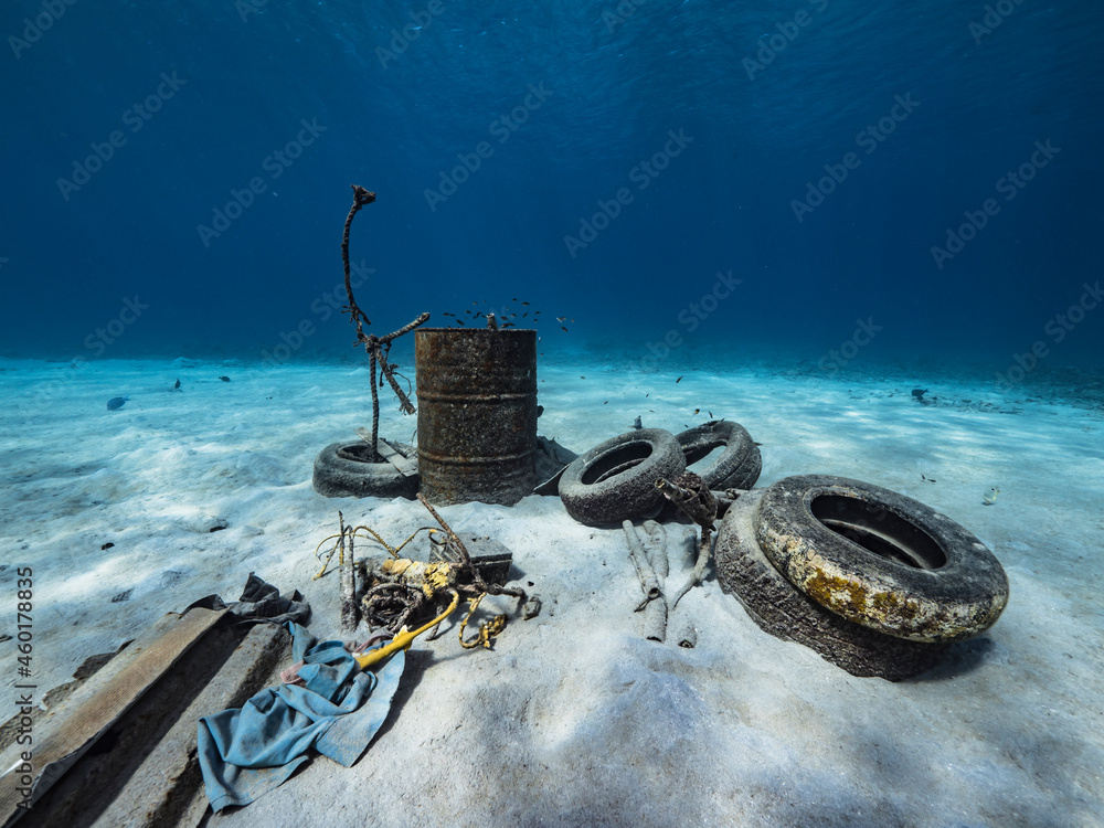Seascape with trash collection in the shallow water of the coral reef ...