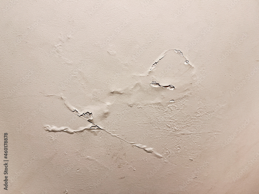 texture of a painted wall with a flaking and cracking defect caused by ...