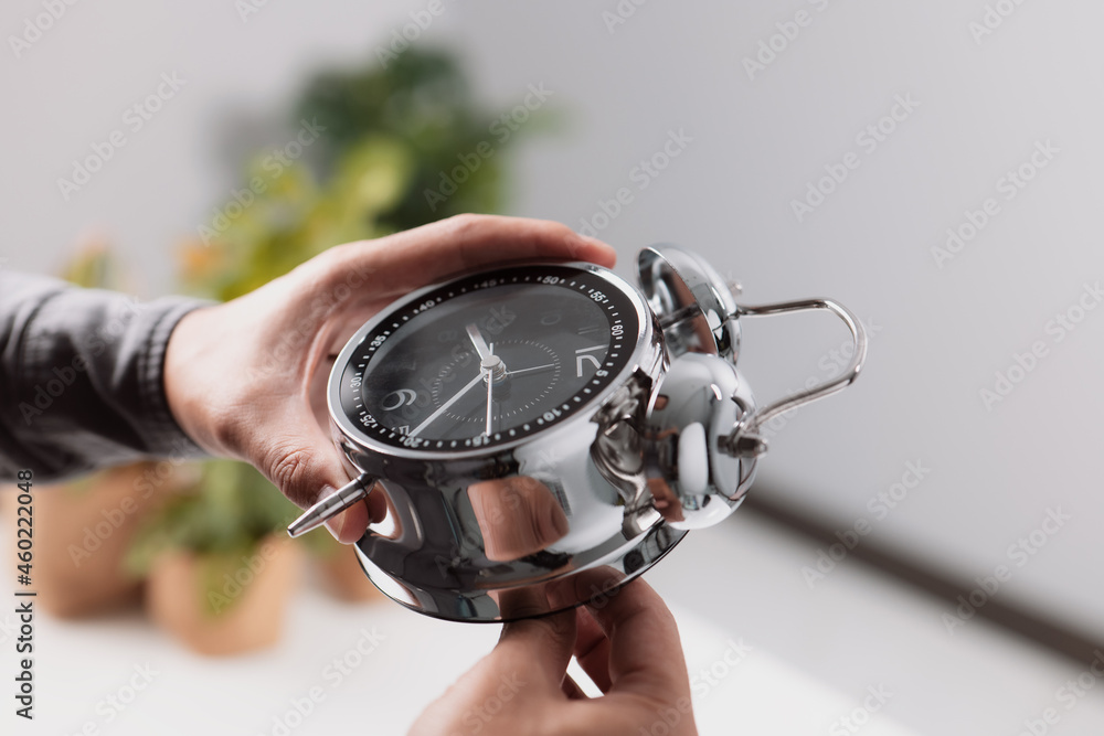 Time management concept. Male hand adjusting or changing the time on ...