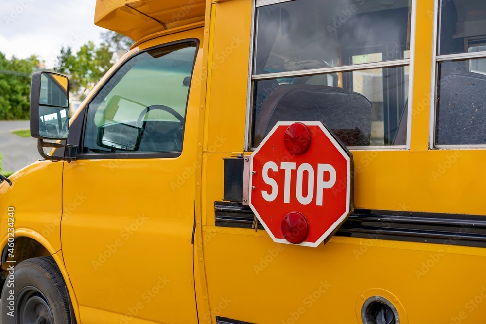 Mini school bus with stop sign on side Stock Photo | Adobe Stock