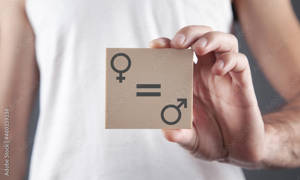 Man showing male and female symbols on wooden board. Concept of gender ...