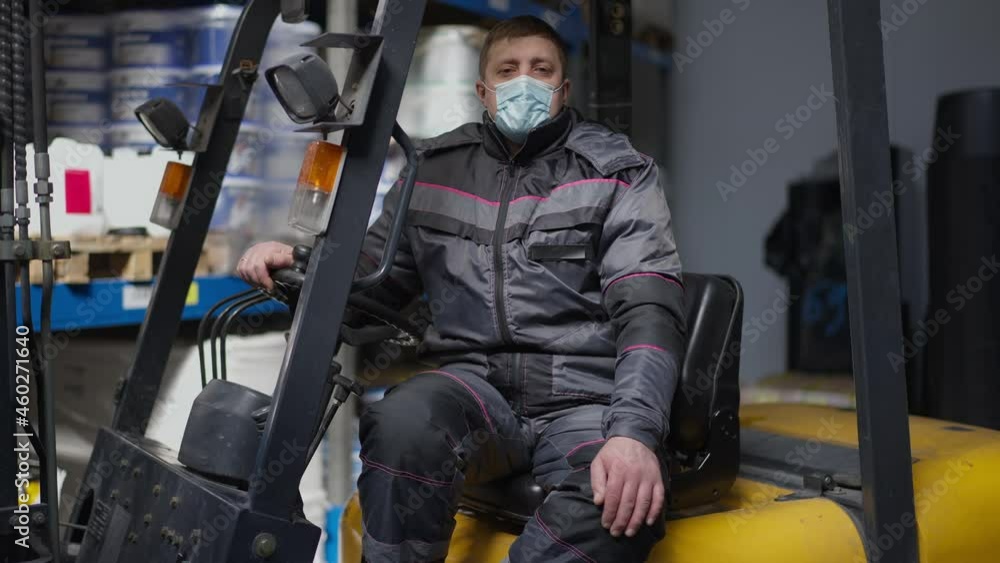 Portrait of Caucasian adult man in coronavirus face mask sitting in ...