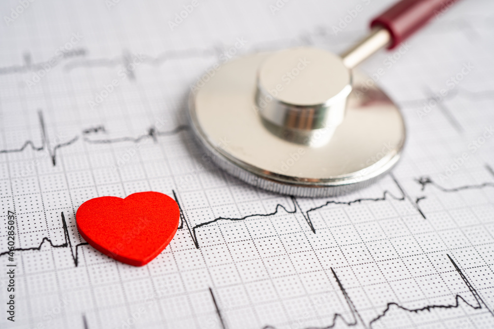 Stethoscope on electrocardiogram (ECG) with red heart, heart wave ...