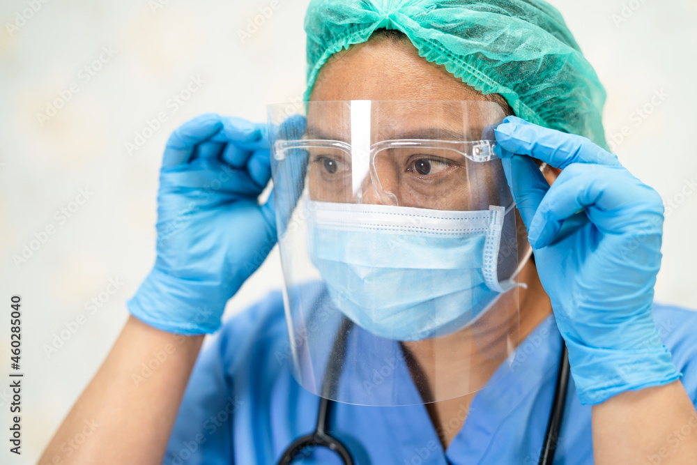 Asian doctor wearing face shield and PPE suit new normal to check ...