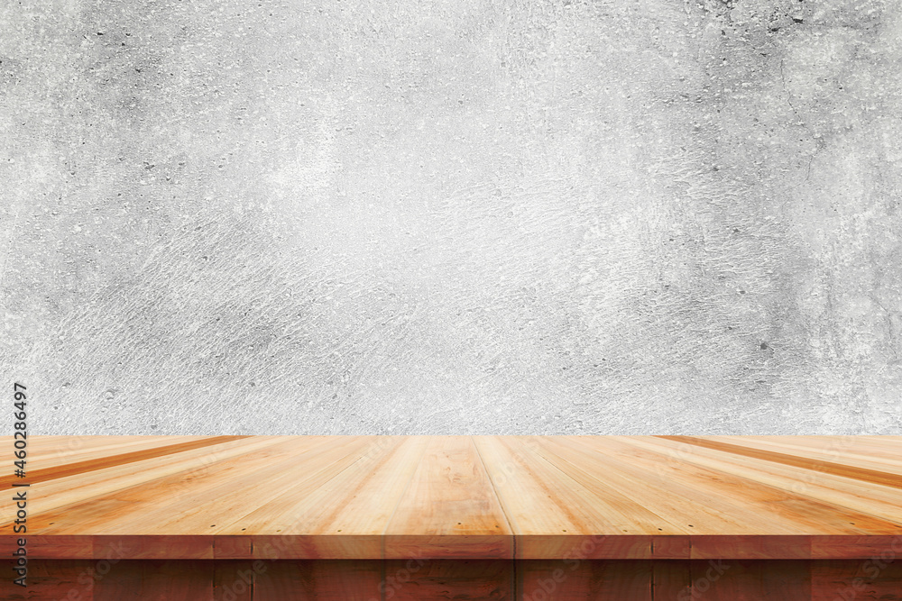 Wood table top on bare concrete wall background - can be used for ...
