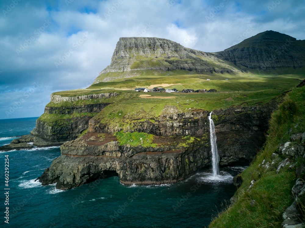 Gasadalur village and its iconic waterfall, Vagar, Faroe Islands ...