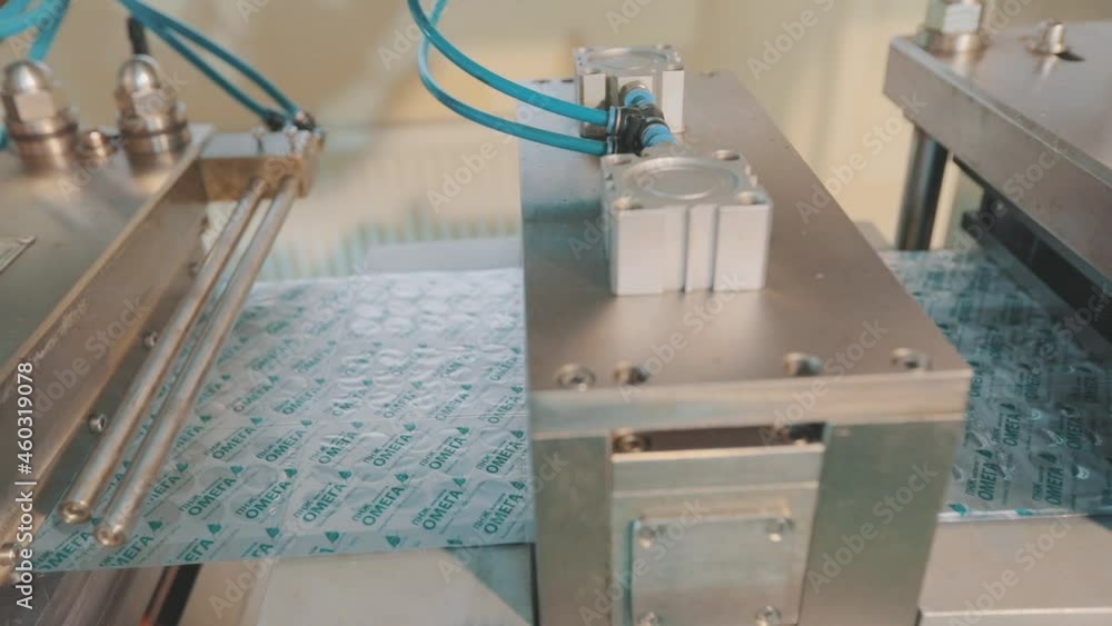 Blister packing of tablets. Tablet manufacturing process. Industrial ...