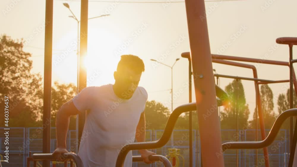 Sporty strong Arab man with well-developed biceps and trapezius muscles ...